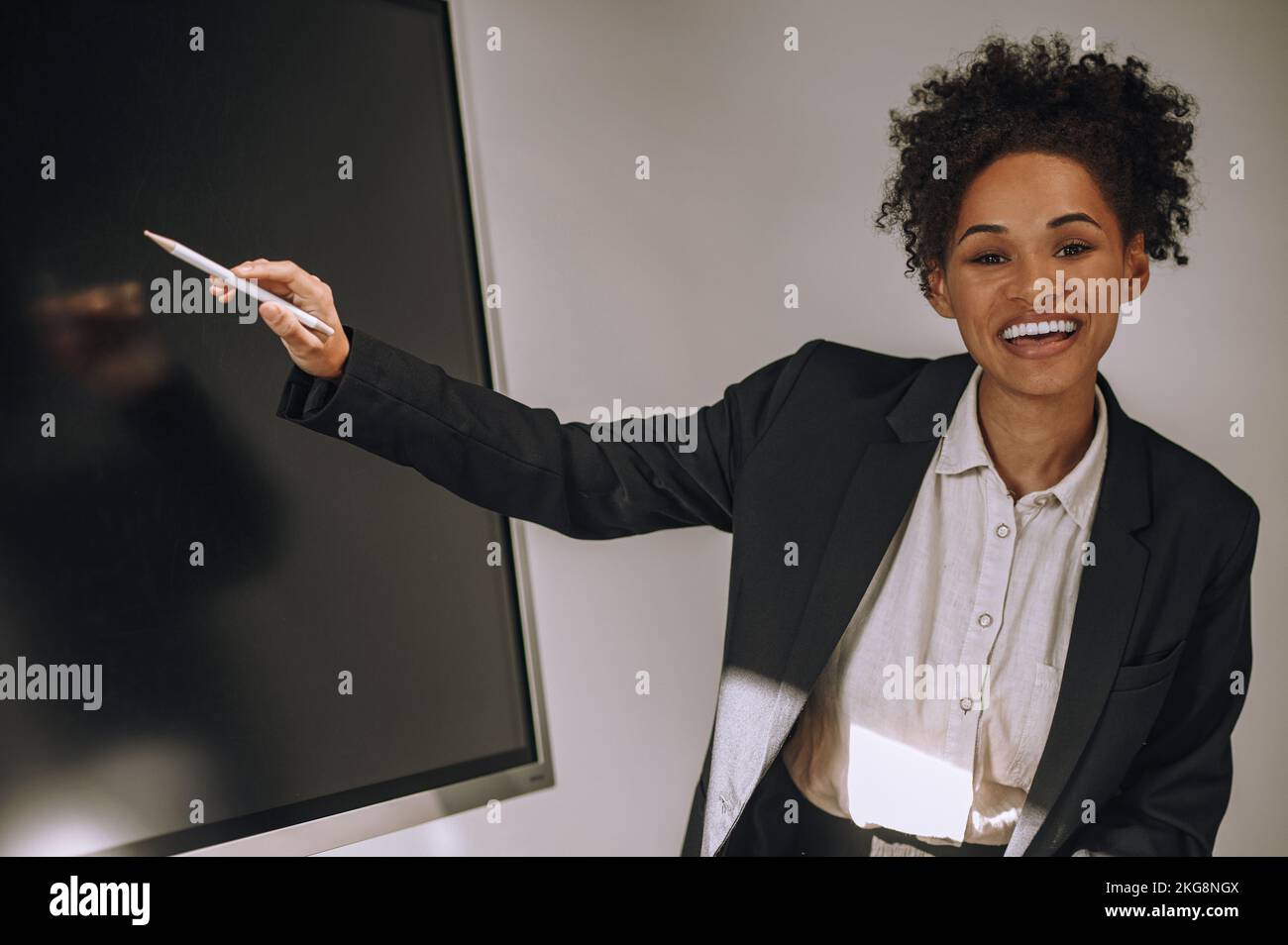 High-spirited young female boss giving a presentation Stock Photo - Alamy