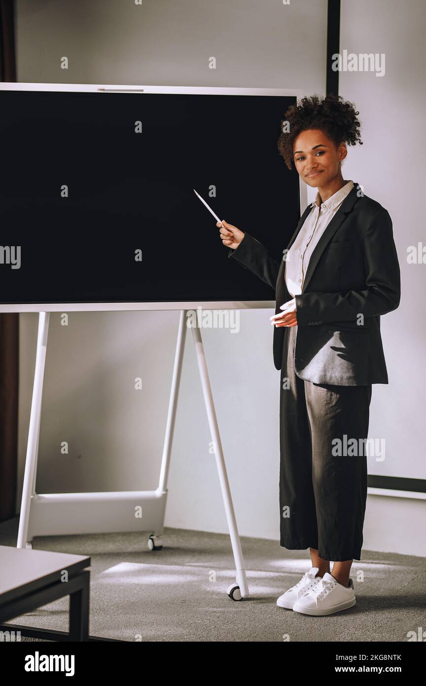 Smiling African American businesswoman giving a presentation Stock ...