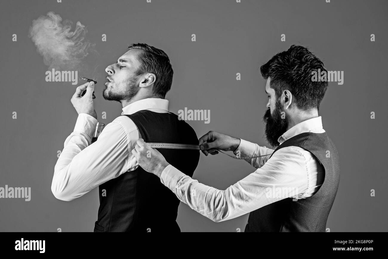 Tailor measure back for sewing suit, grey background Stock Photo - Alamy