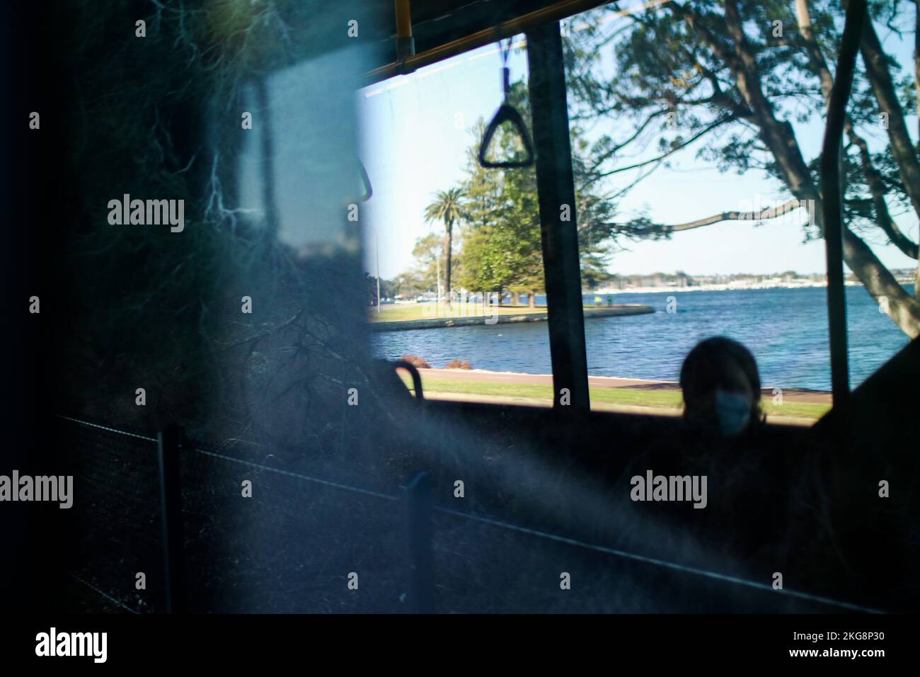 reflection of a commuter on a bus window Stock Photo - Alamy