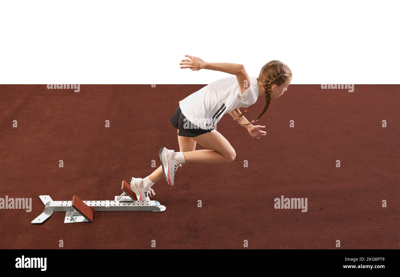 Young athlete, beginner female track runner bursting off starting block ...