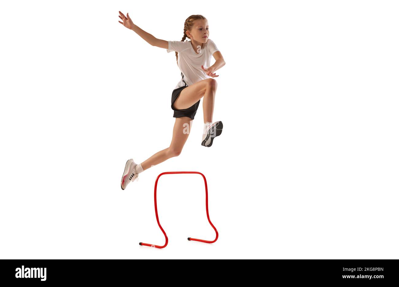 Dynamic portrait of little girl, professional athlete, runner, jogger ...