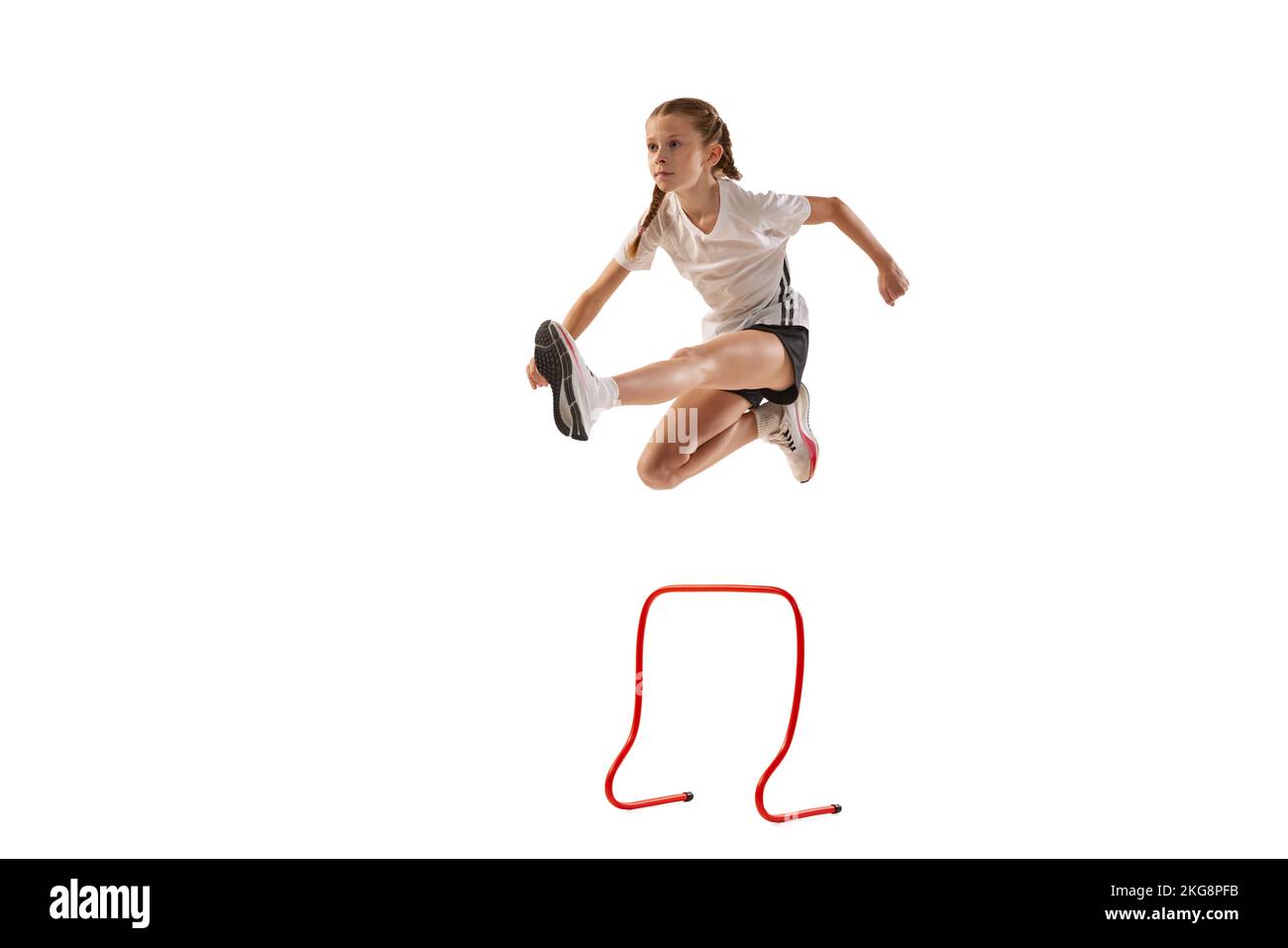 Dynamic portrait of little girl, professional athlete, runner, jogger ...