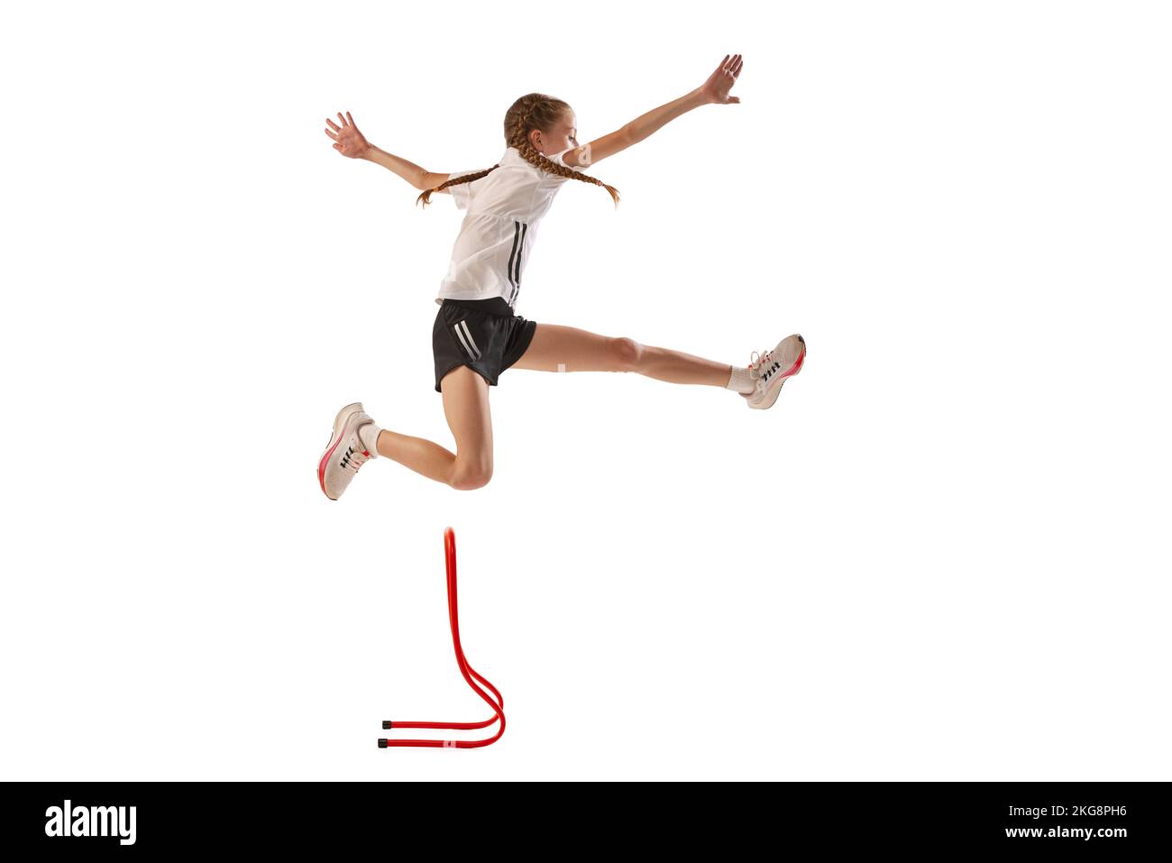 Side view. Dynamic portrait of little girl, professional athlete ...