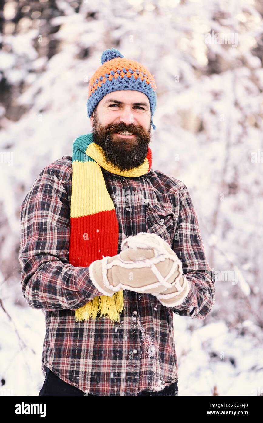 Guy with smiling face with forest covered by snow Stock Photo - Alamy