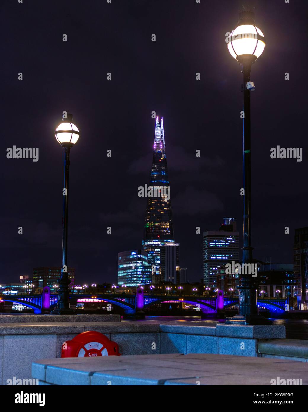 The Shard at night with the lights on and the Southwark Bridge lit up ...