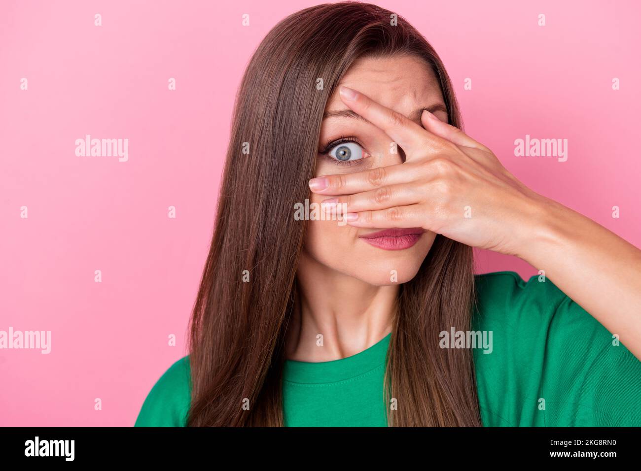 Portrait of sweet lovely frightened girl with long hairstyle wear green ...