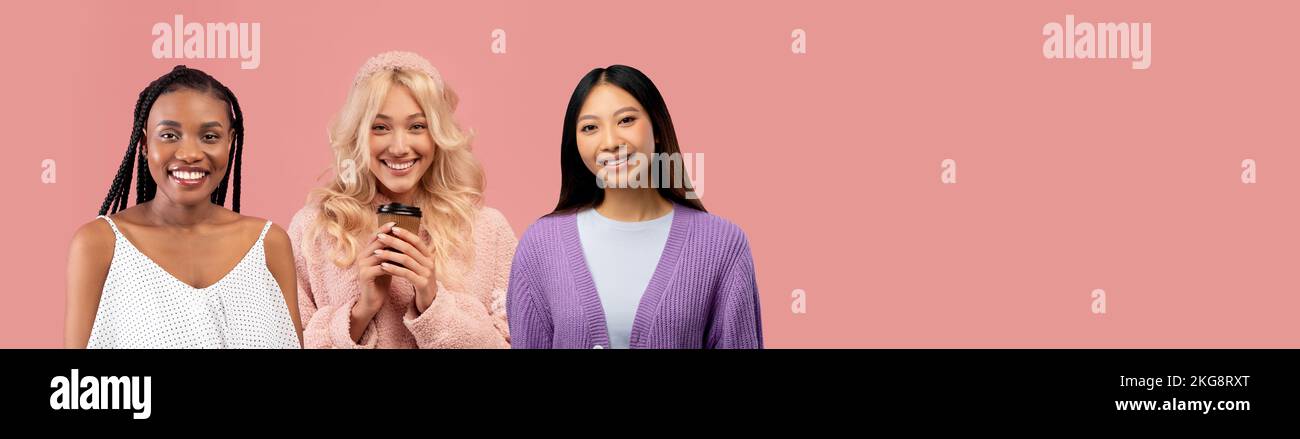 Cute multicultural young ladies posing on pink background Stock Photo ...