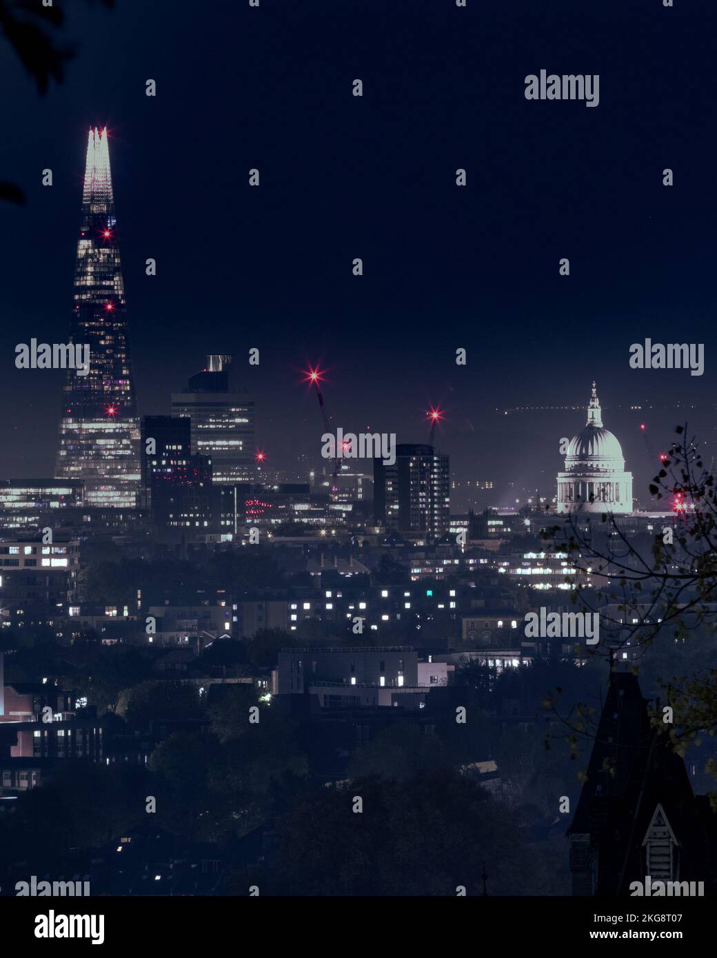 A view of the London skyline taken at night with light trails, showing ...