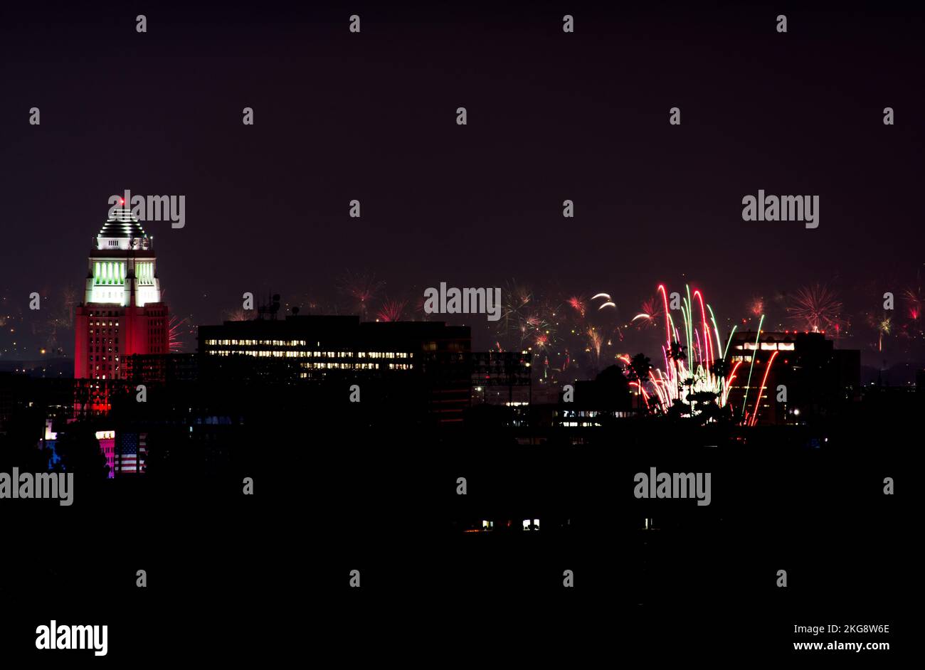 The glowing fireworks celebration in the night sky of Los Angeles city ...