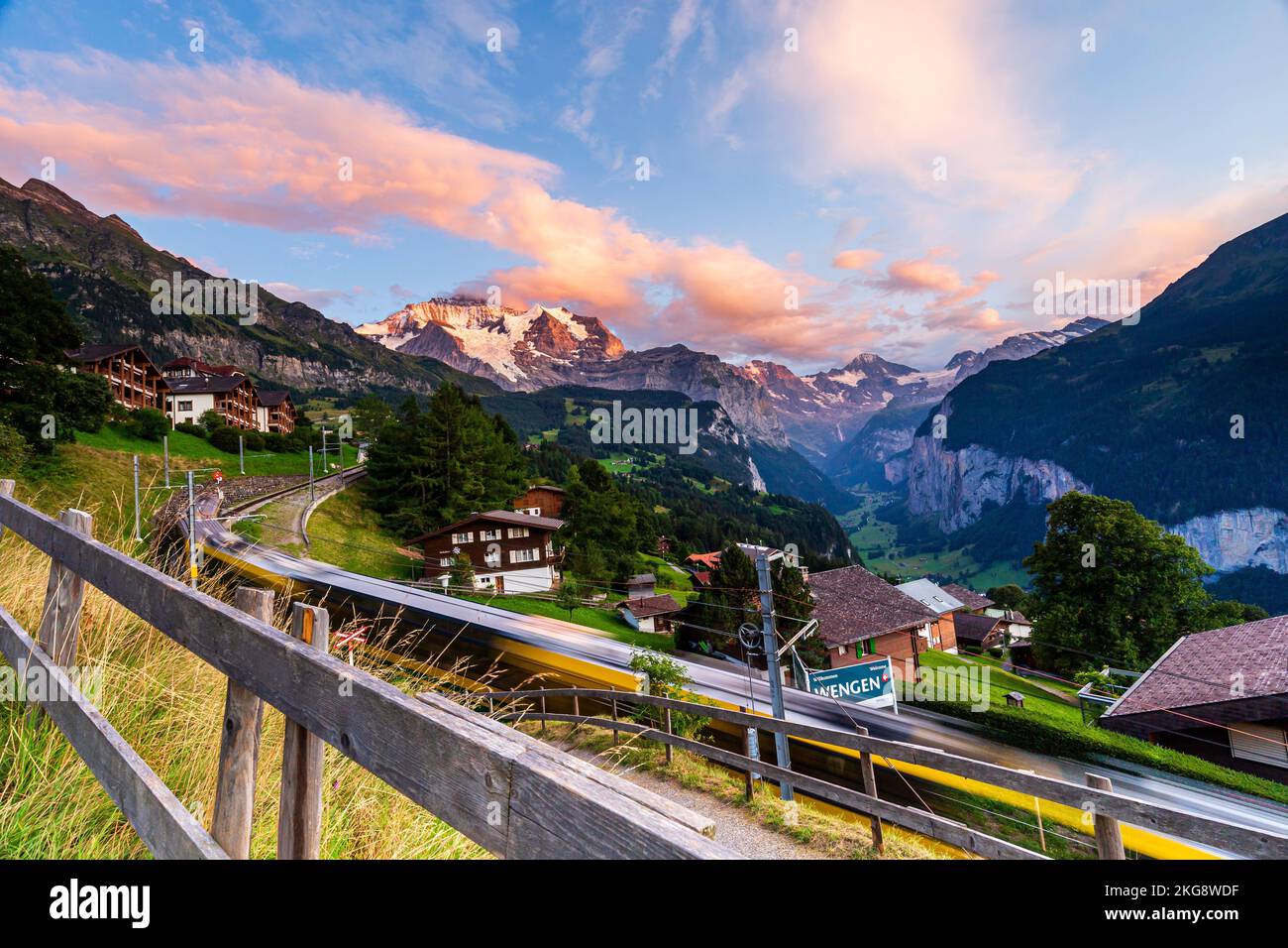 The beauty of the Swiss Alps at sunset. Long exposure of a railroad ...