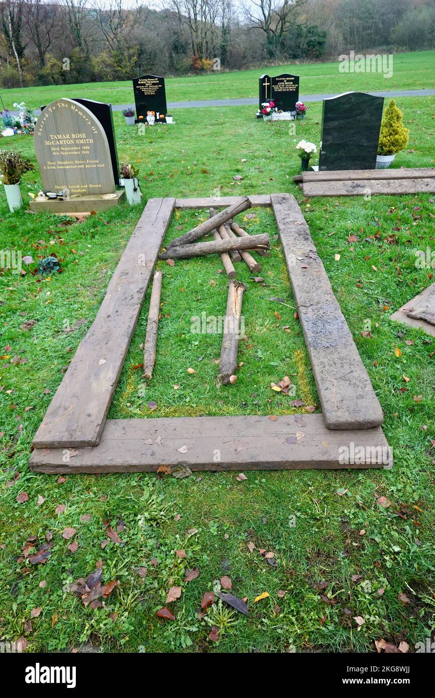 A wooden template in preparation for the digging of a grave in ...