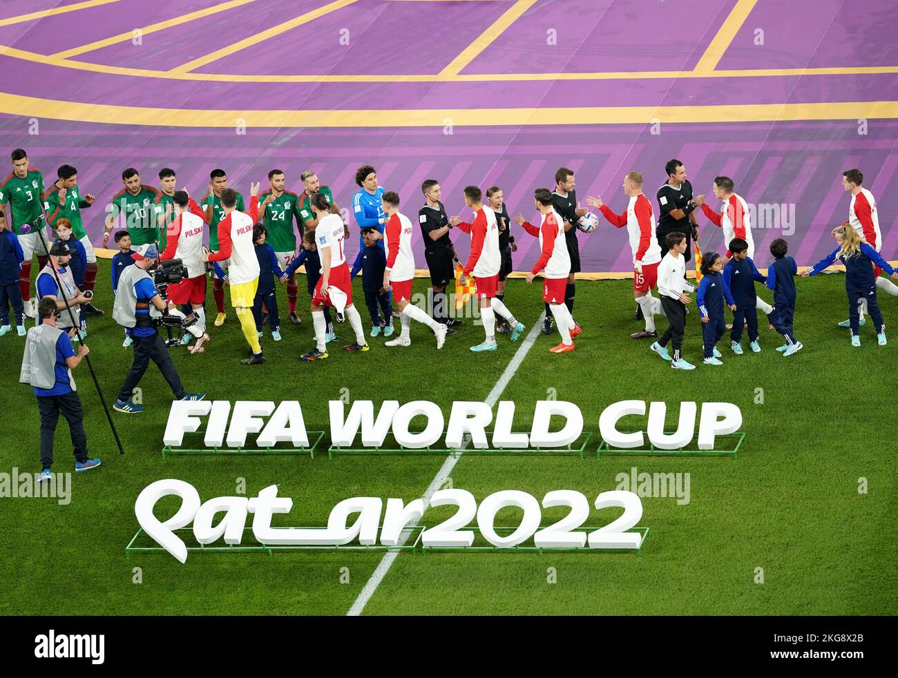 Poland and Mexico players shake hands ahead of the FIFA World Cup Group ...