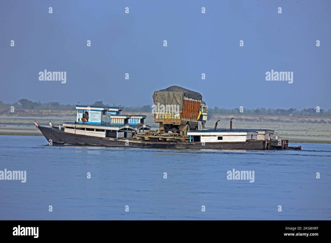 two river ferries in tandem to carry truck over the river Lohit River ...