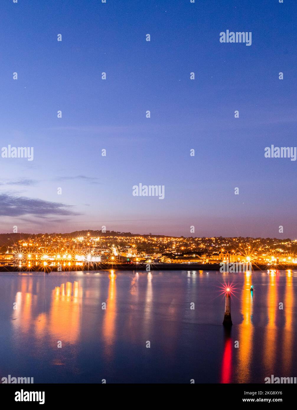 Night time view of the seaside port of Teignmouth from across the river ...