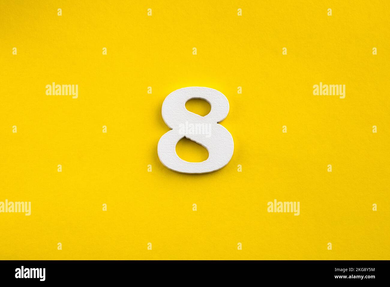 Number eight - white number in wood on yellow background Stock Photo ...
