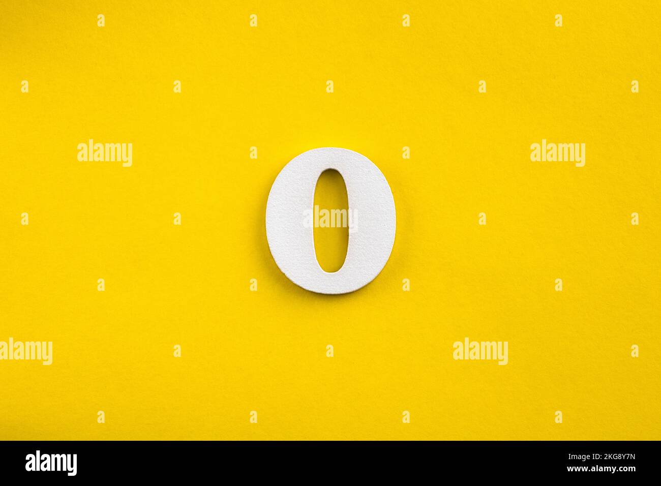 Number zero - white number in wood on yellow background Stock Photo - Alamy