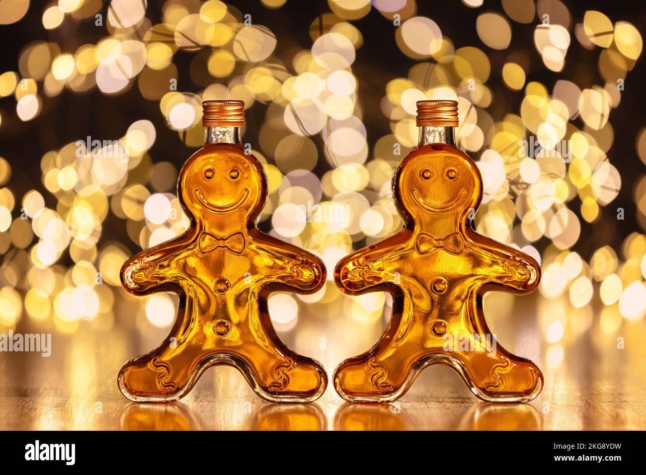 Bottles of homemade gingerbread syrup on light spotty background Stock ...