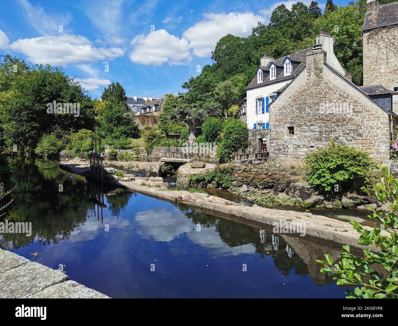 A beautiful view of a small lake in front of the houses during the ...