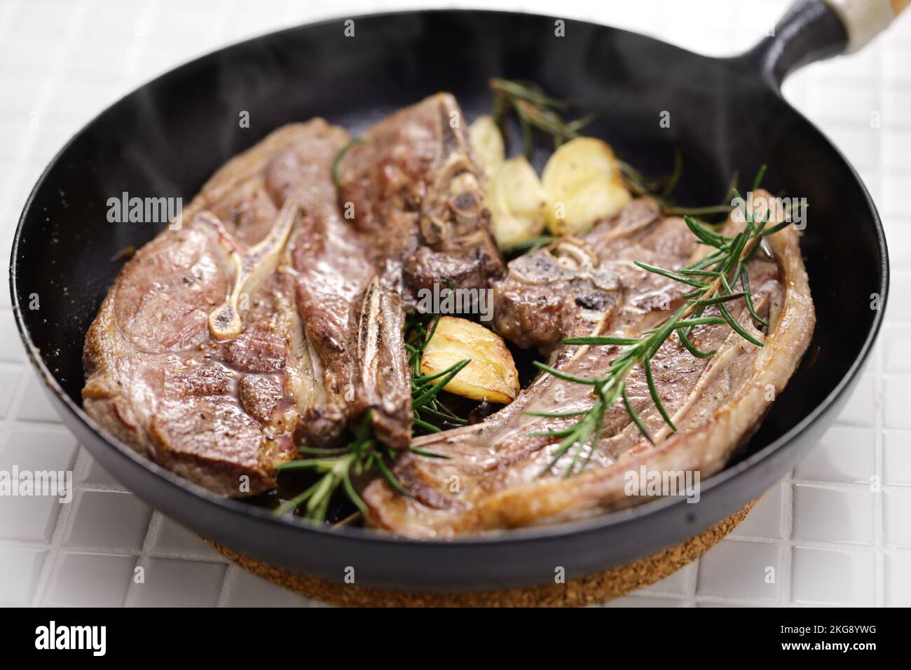 lamb shoulder chop steaks on a skillet Stock Photo - Alamy