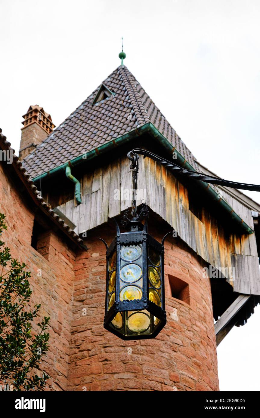 Old lantern hanging outdoor an tower at background in Haut-Koenigsbourg ...