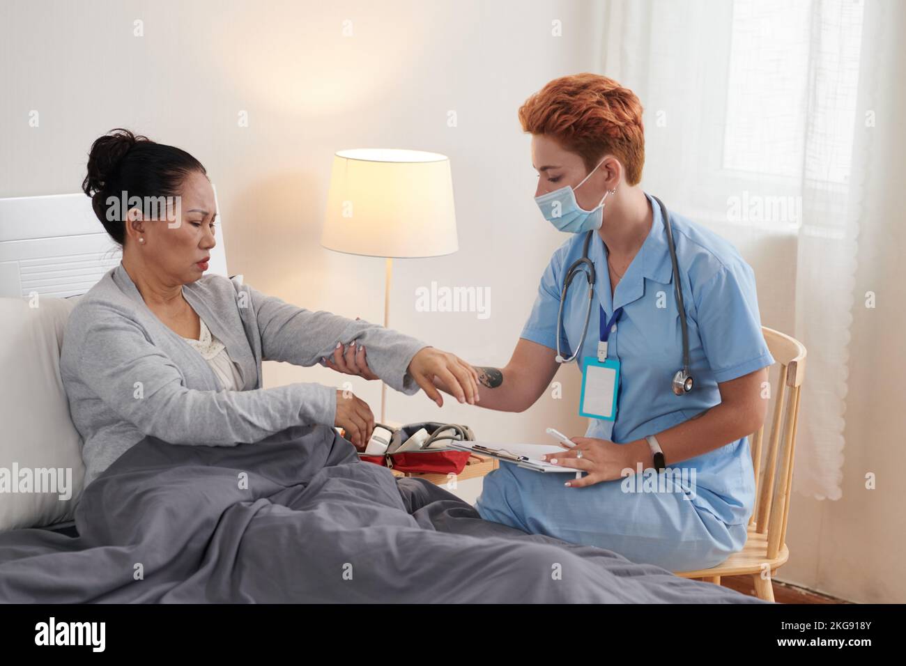 Sick senior woman suffering from pain in her left arm, heart disease ...