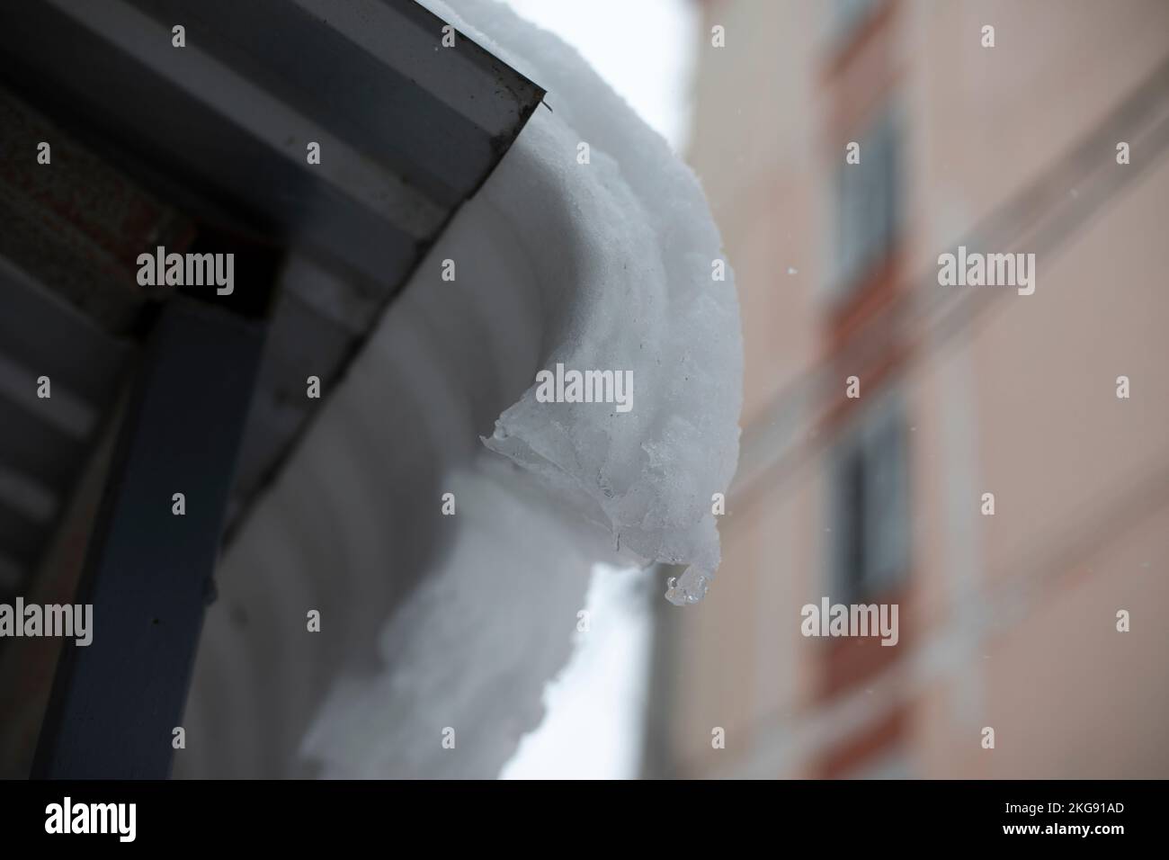 Snow on roof. Roof canopy with ice. Snow on building. Details of icy ...