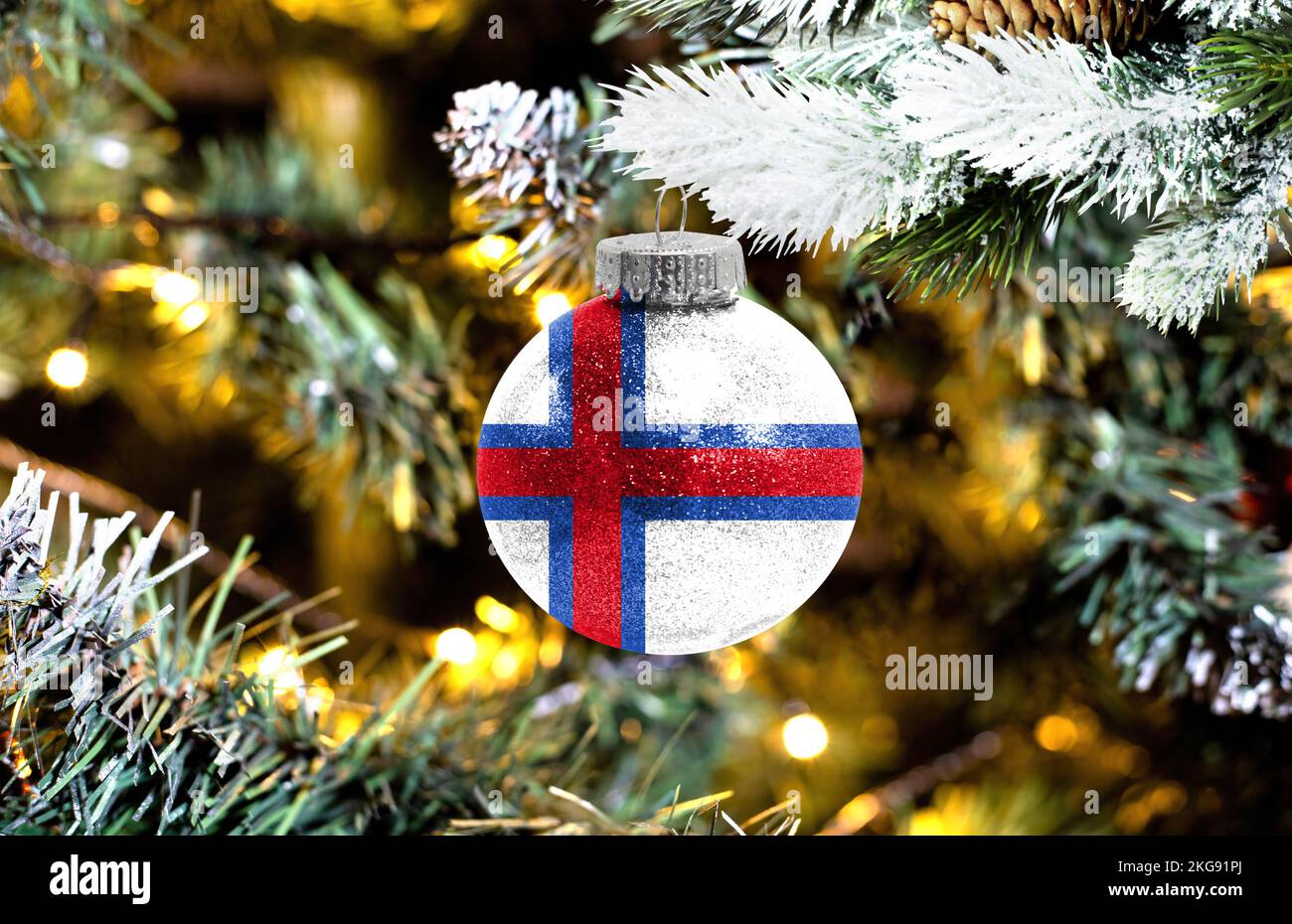 New Year's glass ball with the flag of Faroe Islands against a colorful ...