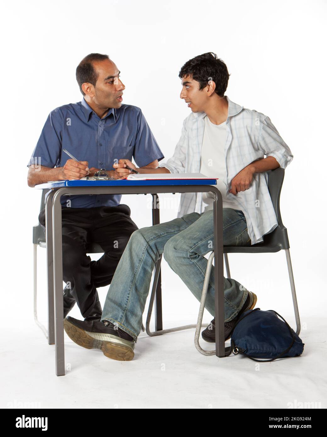 Teenagers listening to teacher hi-res stock photography and images - Alamy