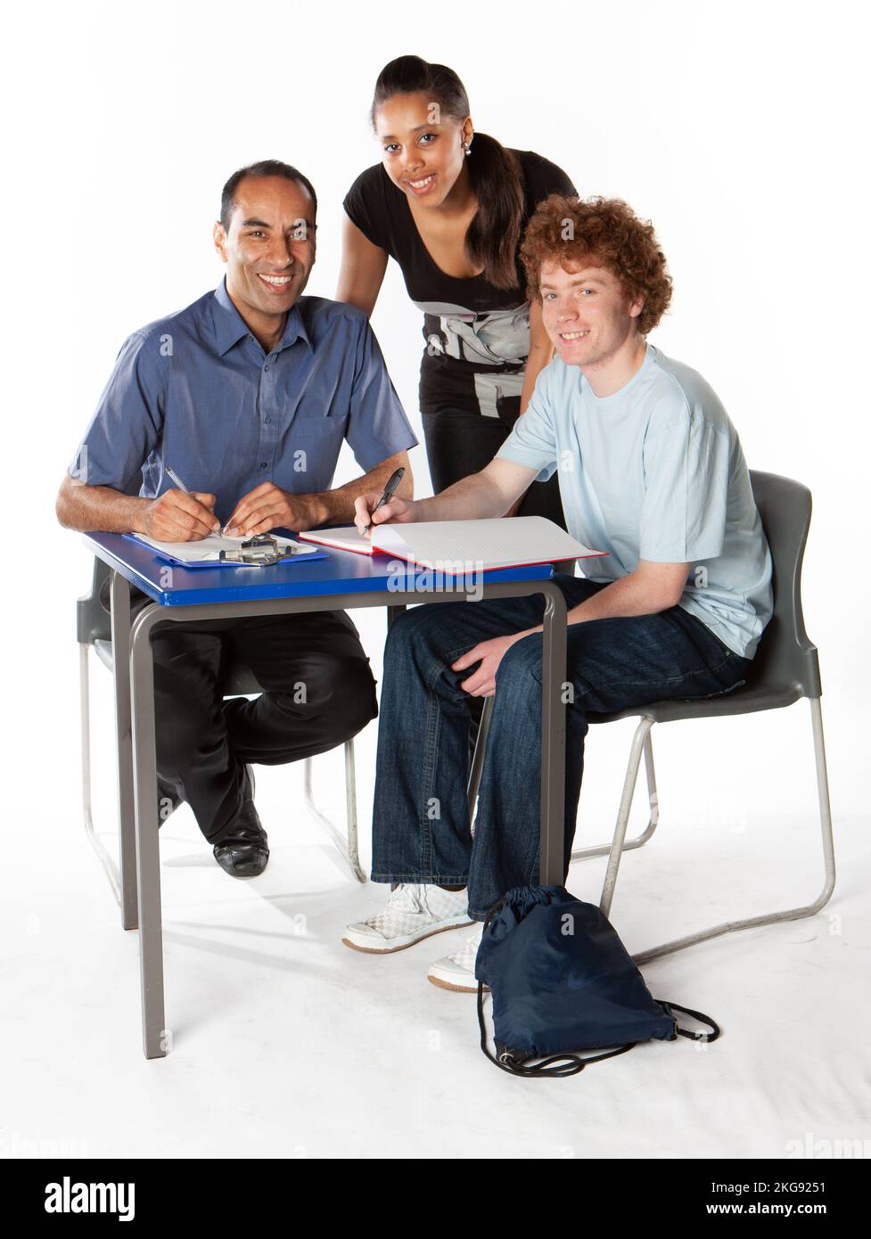 Teenagers: Group Work. A pair of late teenage school pupils at a desk ...