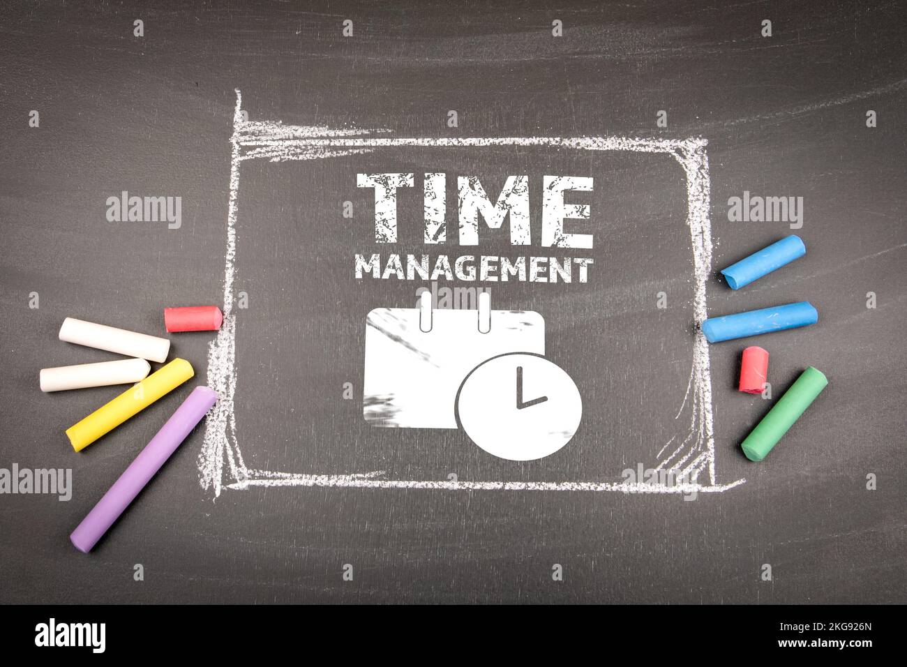 Time management concept. Text and colored pieces of chalk on a ...