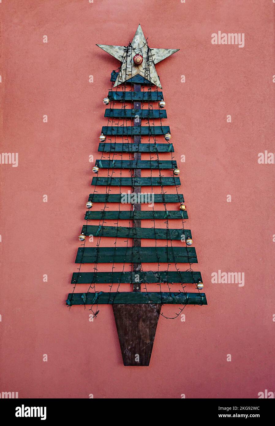 DIY Christmas tree made from planks as outdoor wall decoration. Xmas ...