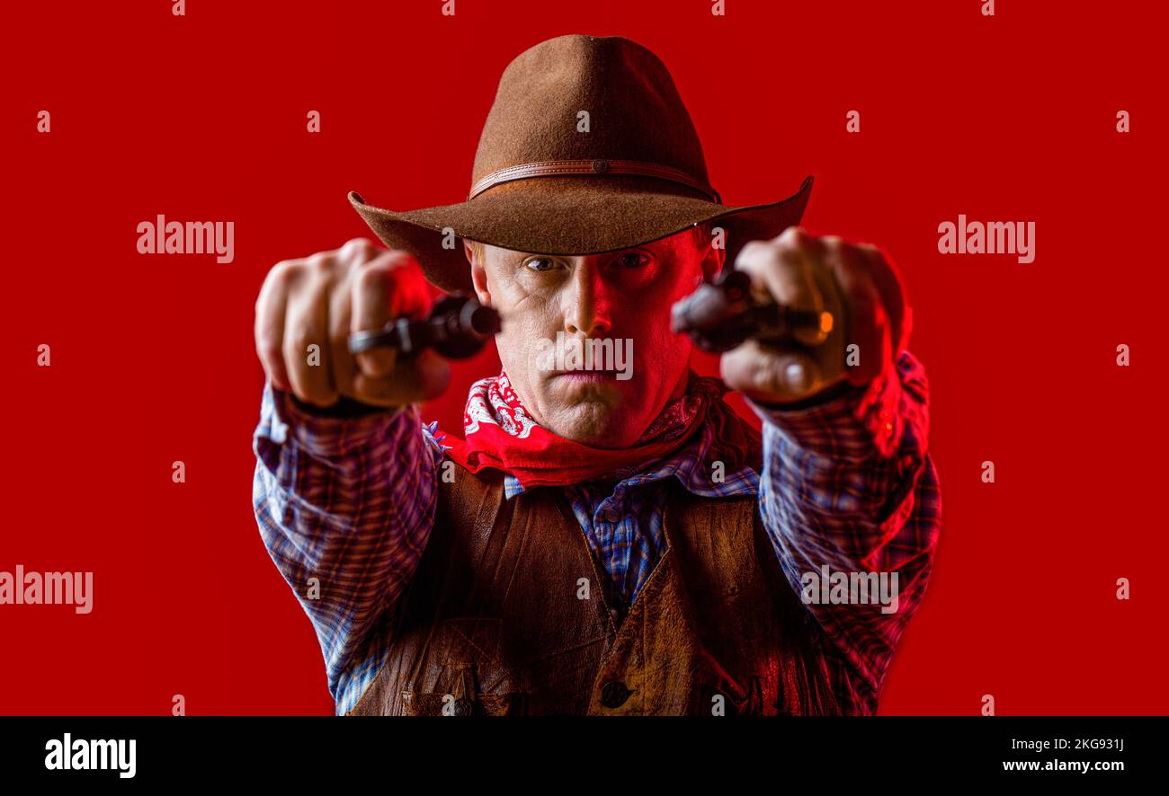 West, guns. Portrait of a cowboy. Western man with hat. Portrait of ...