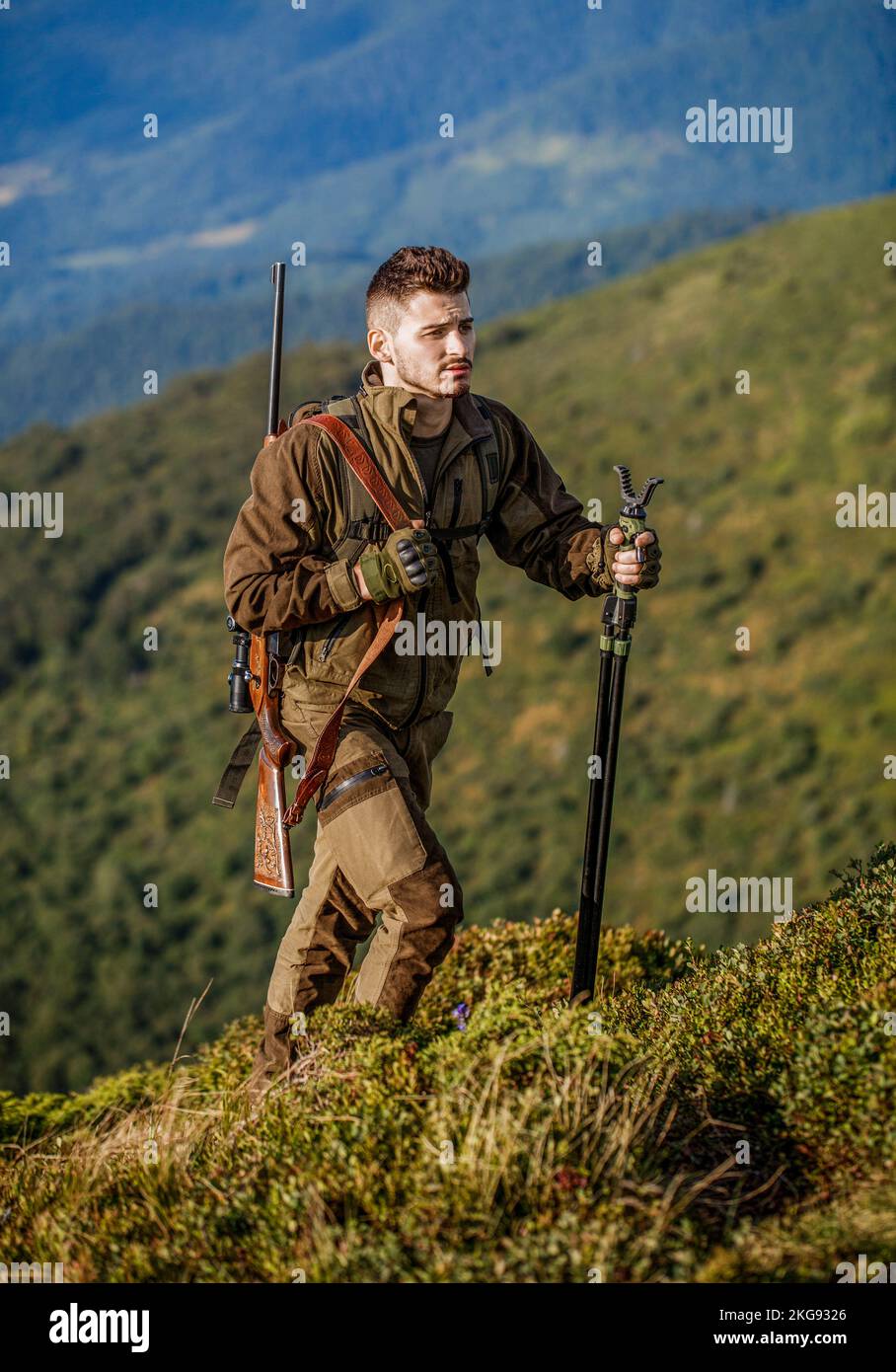Hunter with hunting gun and hunting form to hunt. Hunter is aiming. The ...