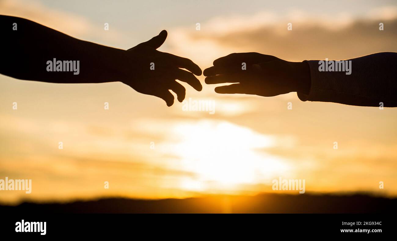 Outstretched hands, salvation, help silhouette, concept help. Giving a helping hand. Rescue ...