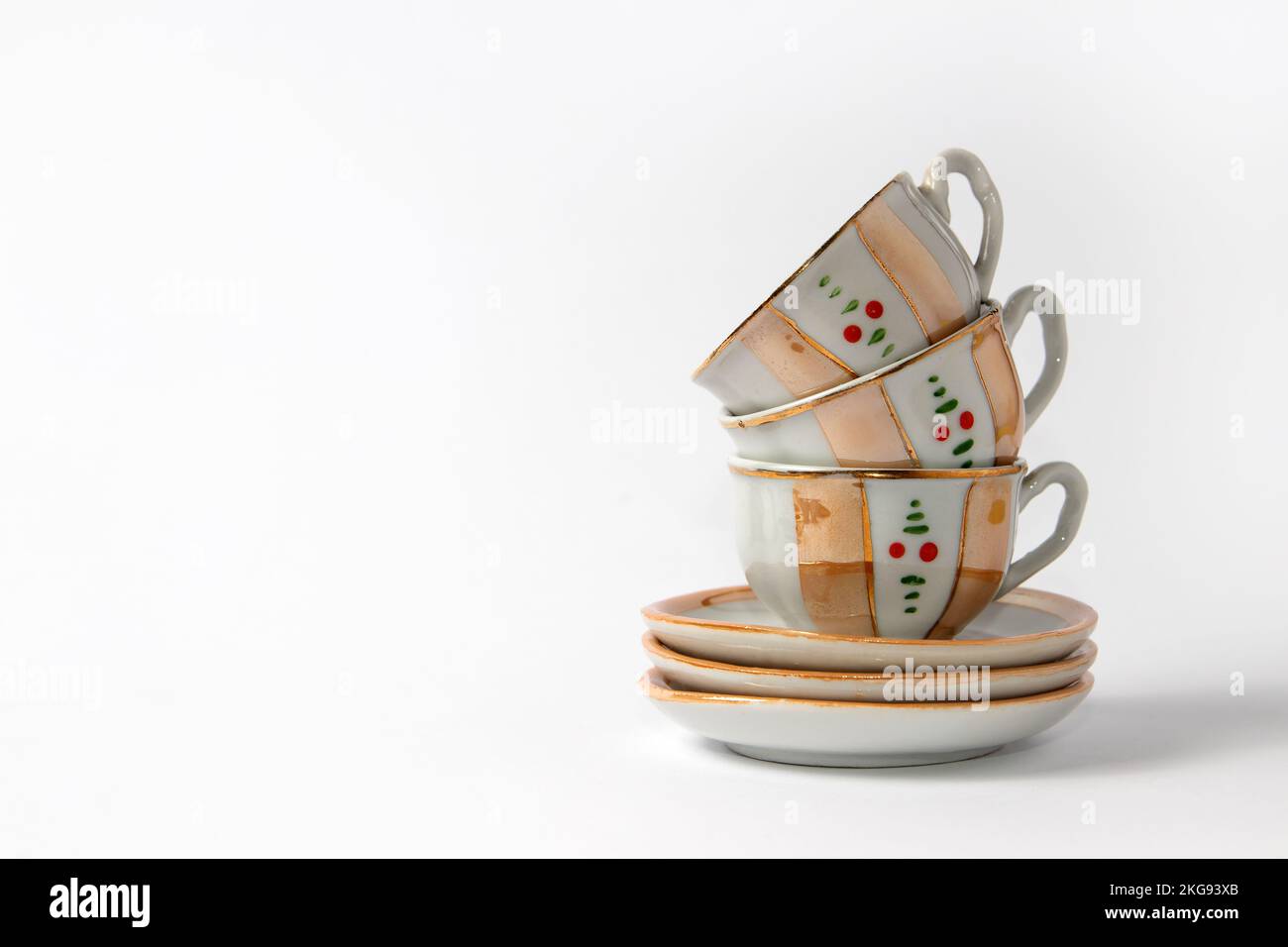 Stack of vintage tea cups on white background Stock Photo - Alamy
