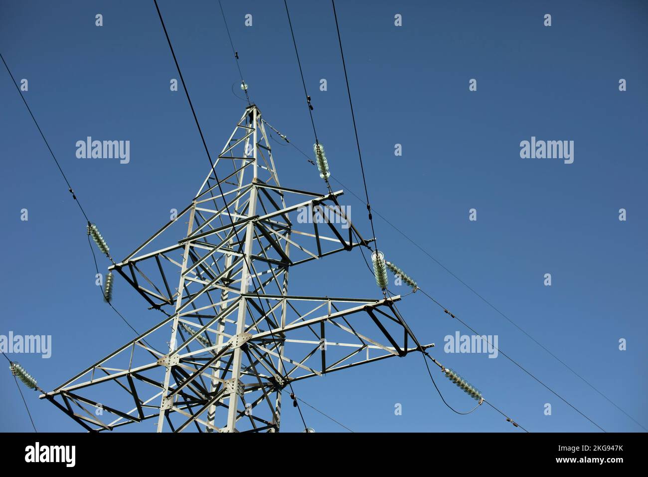 Electric transmission line in forest. Steel tower with wires. High ...