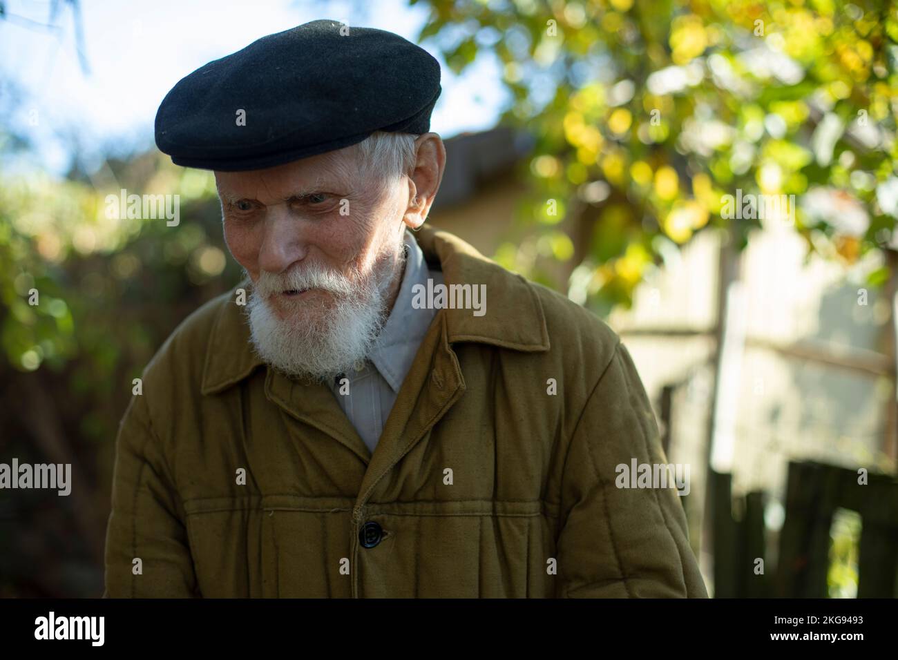 Old man from Russia. Gray beard and black cap. Old man in garden. Old ...