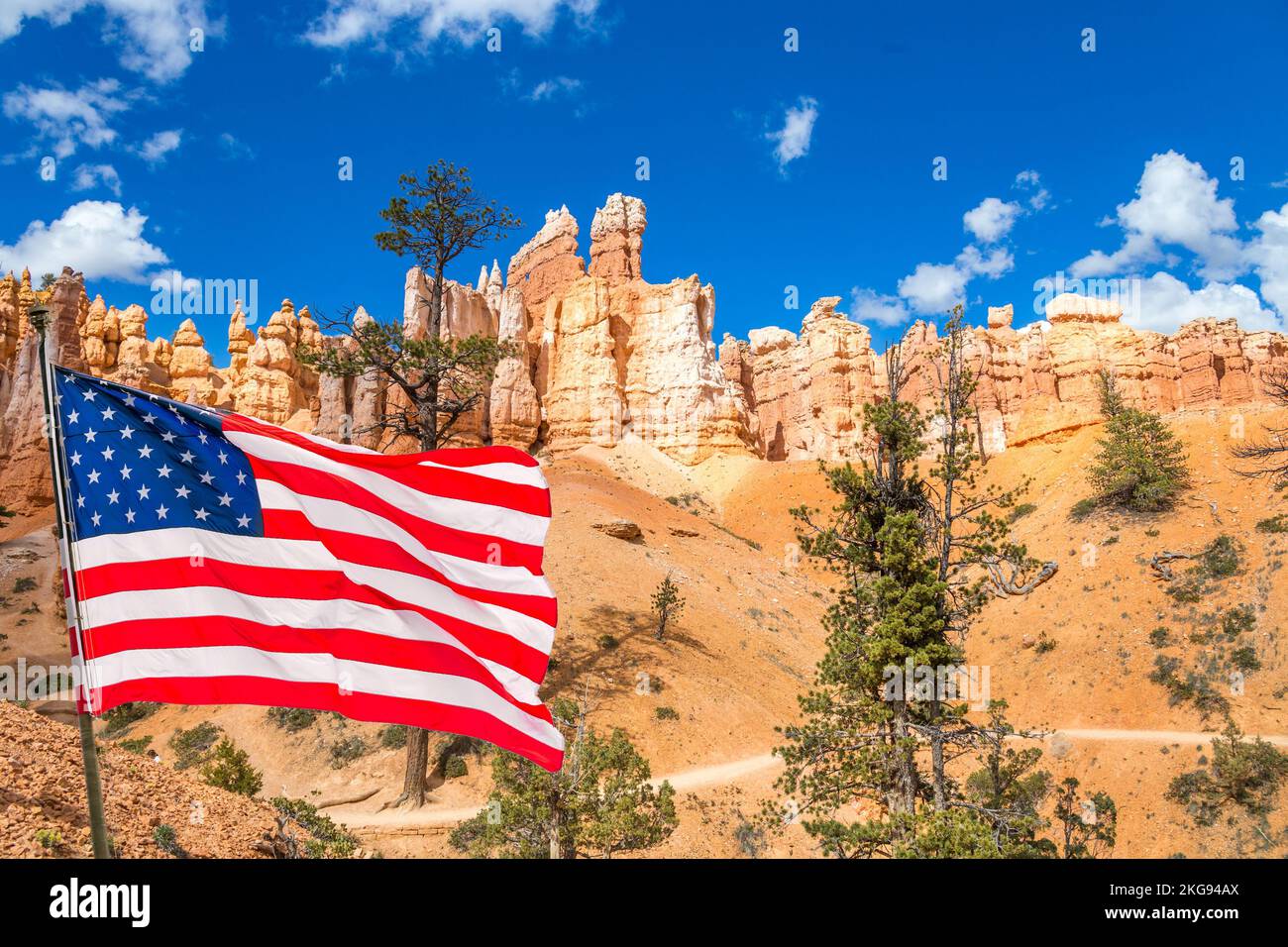 American flag waving in the wind in Bryce canyon national park in Utah ...