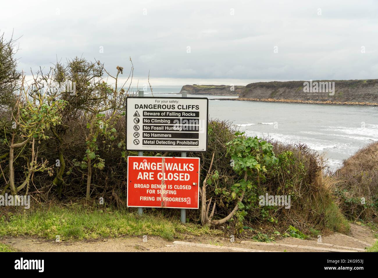 A sign warns of dangerous cliffs below and the closure of a walk on the ...