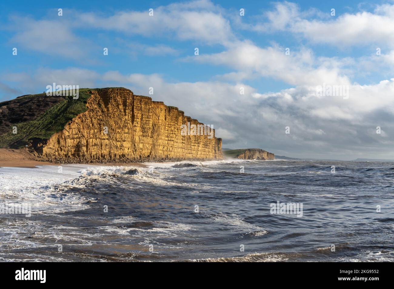 A view of the dramatic sunlit cliffs at West Bay, Dorset, UK Stock Photo - Alamy
