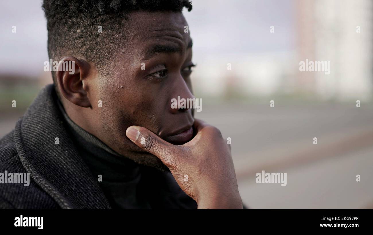 Stressed ou black African man feeling neck pain due to emotional ...