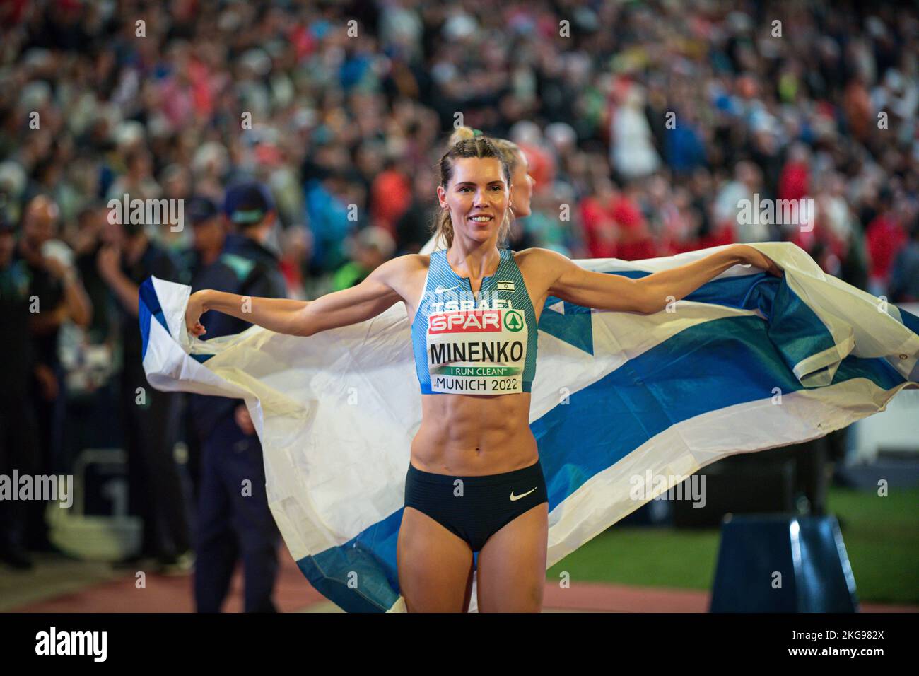 Hanna Minenko with her country's flag of the triple jump at the European Athletics Championships ...
