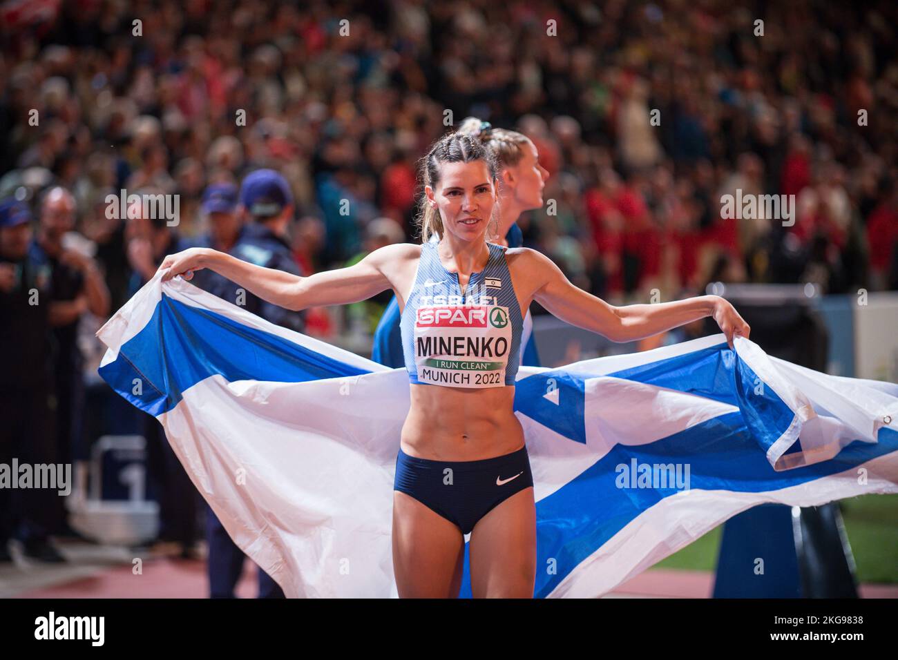 Hanna Minenko with her country's flag of the triple jump at the European Athletics Championships ...