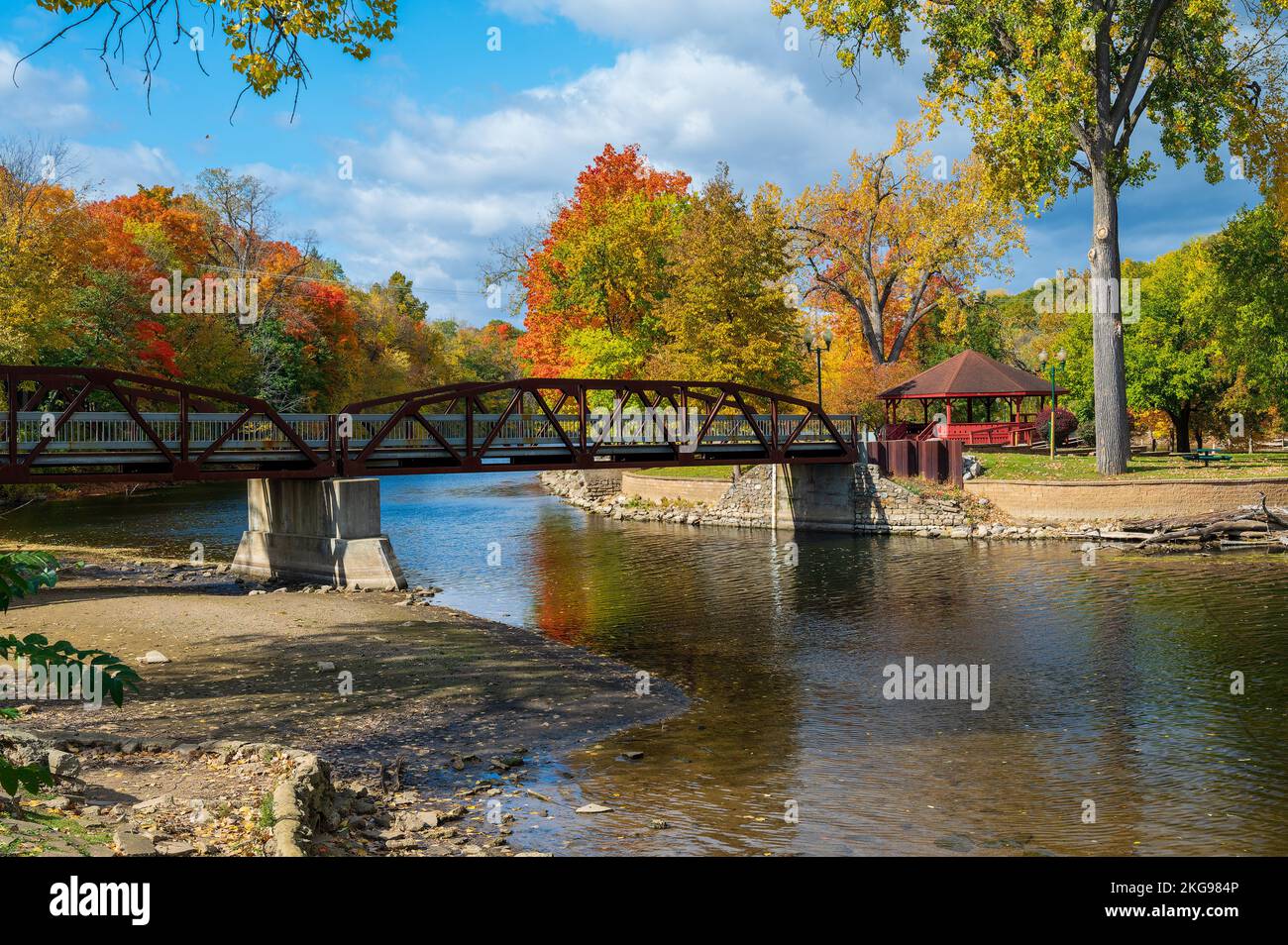 Vibrant fall colors surrounding the bridge in Island Park Grand Ledge ...