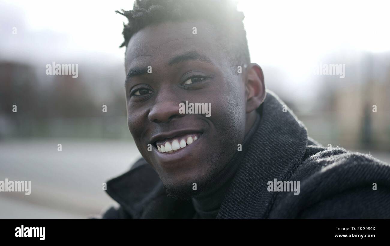 Smiling happy young black African man portrait face expression Stock ...