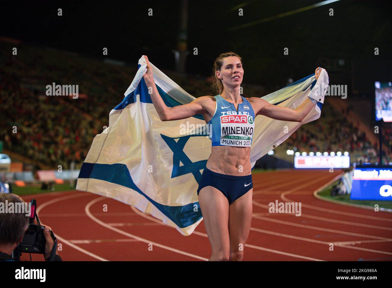 Hanna Minenko with her country's flag of the triple jump at the ...