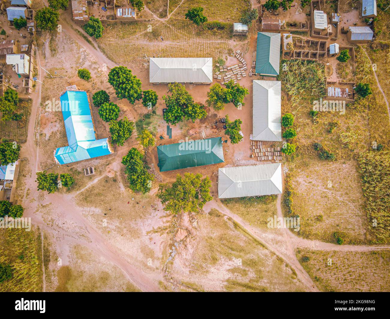The view of rural buildings surrounded by green vegetation. Kurba ...