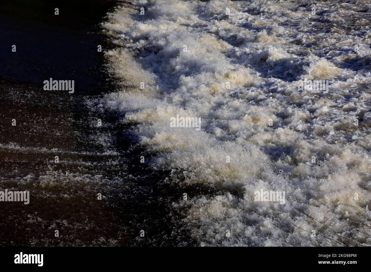 The river Taff at Blackweir after heavy rain. White water at the weir ...