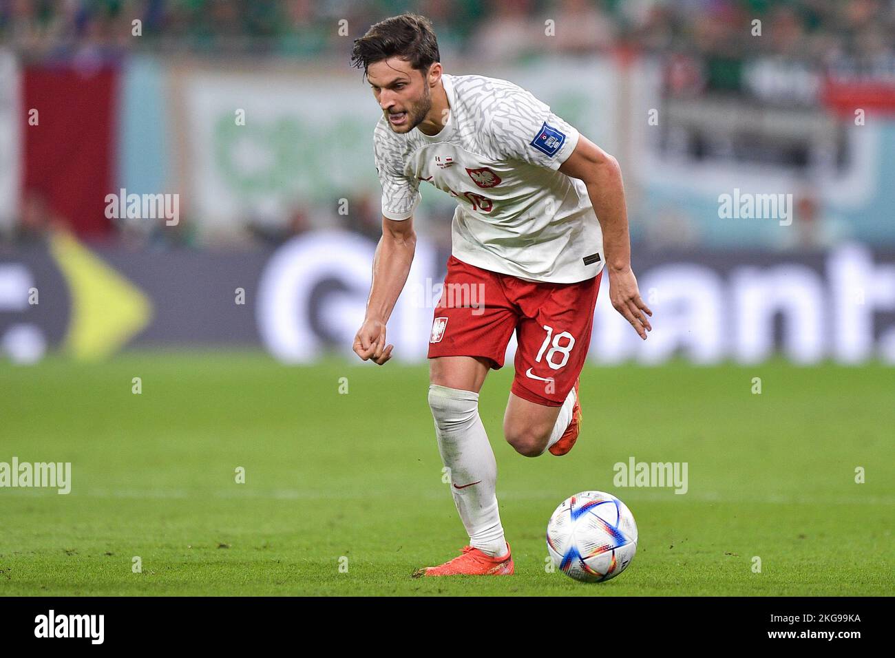 DOHA, QATAR - NOVEMBER 22: Bartosz Bereszynski of Poland runs with the ...